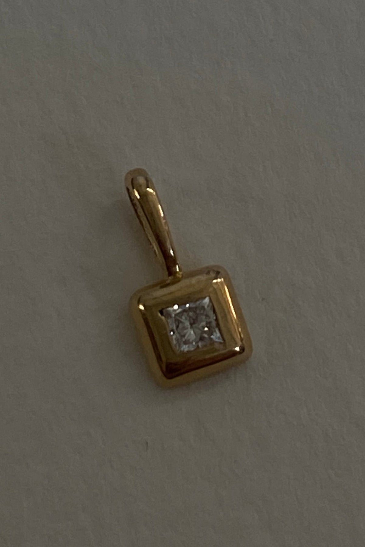 token diamond puff charm– CCNY